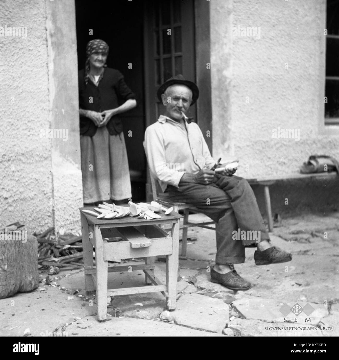 1955 photograph showing Stefan Hrvatin crafting wooden spoons (čajpe ...