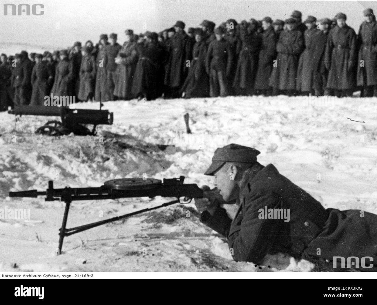 A soldier of the Anders Army is shown with a light machine gun ...