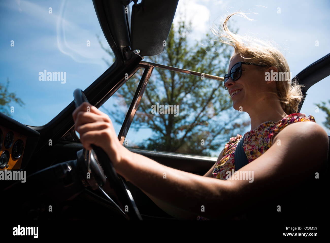 Woman driving a classic convertible Stock Photo - Alamy