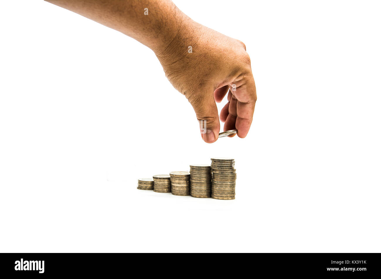 coin stacks with hand on white background Stock Photo - Alamy