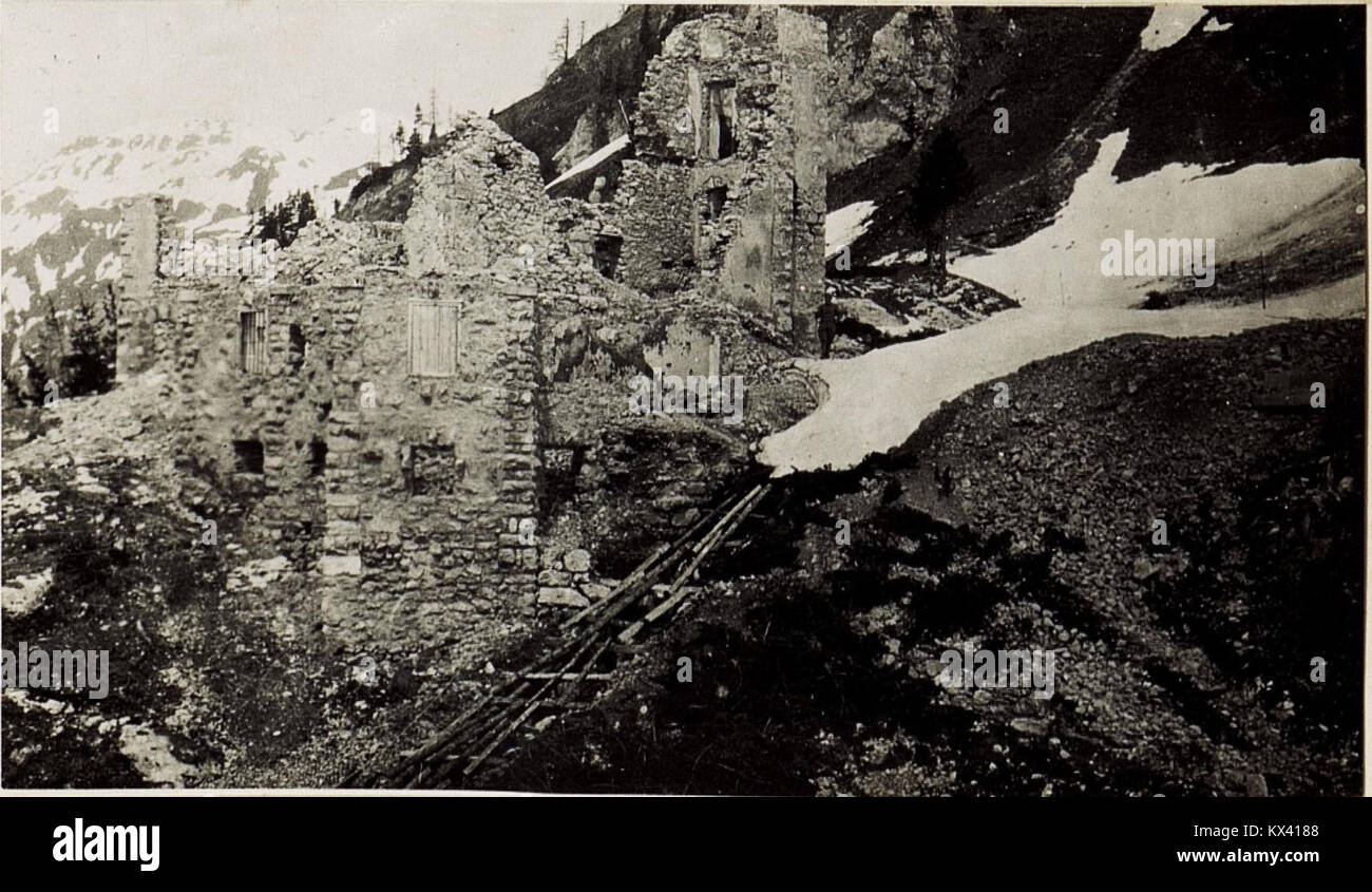 A photograph of the ruined Bamberger House seen from a trench during ...
