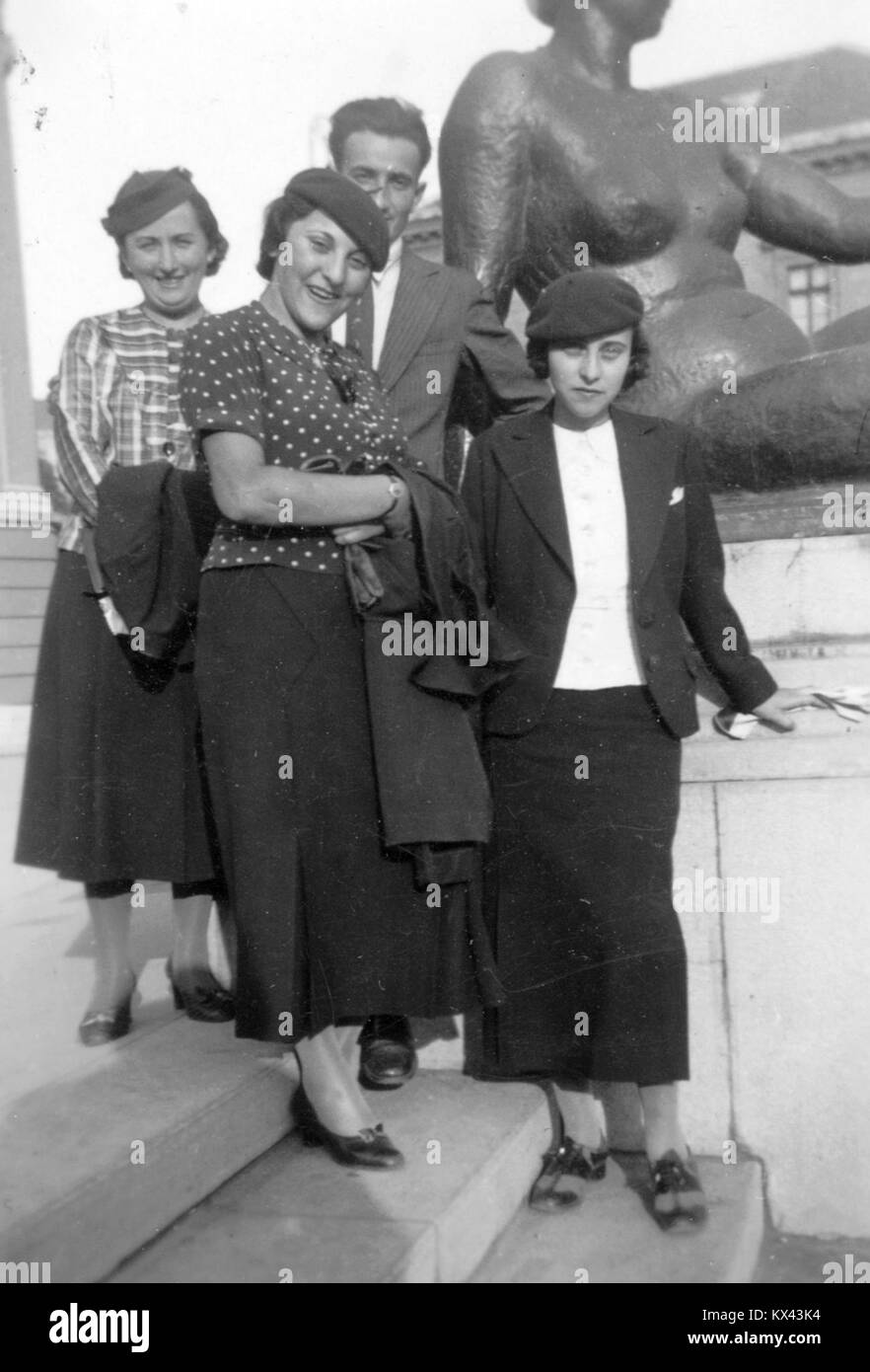 This image depicts a portrait in front of an allegorical sculpture at ...