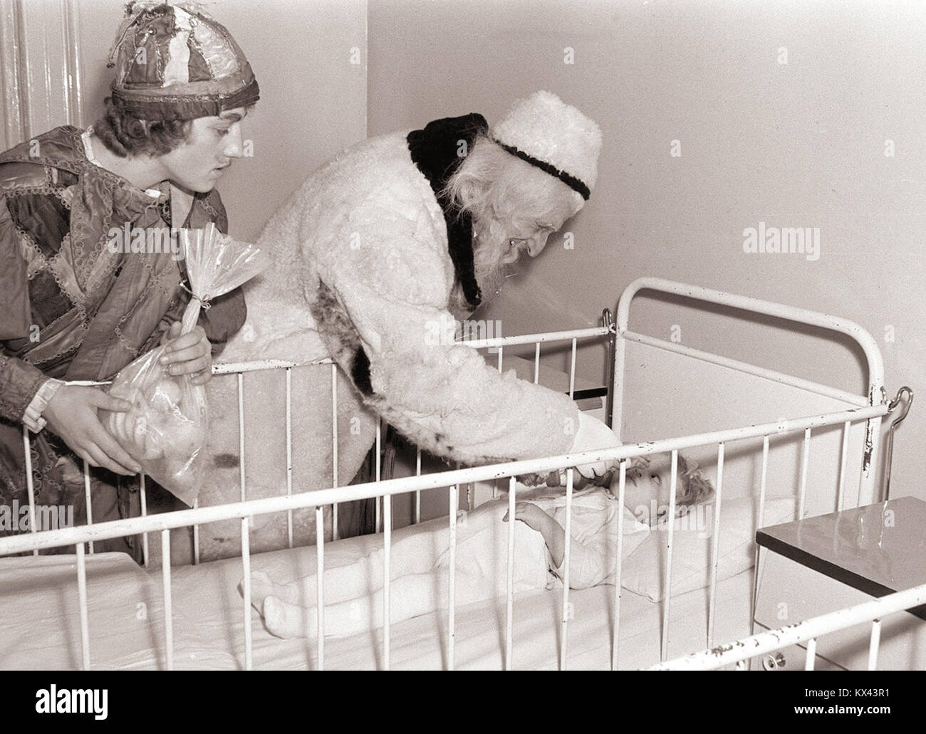 This 1959 photograph shows Dedek Mraz visiting children at a hospital ...