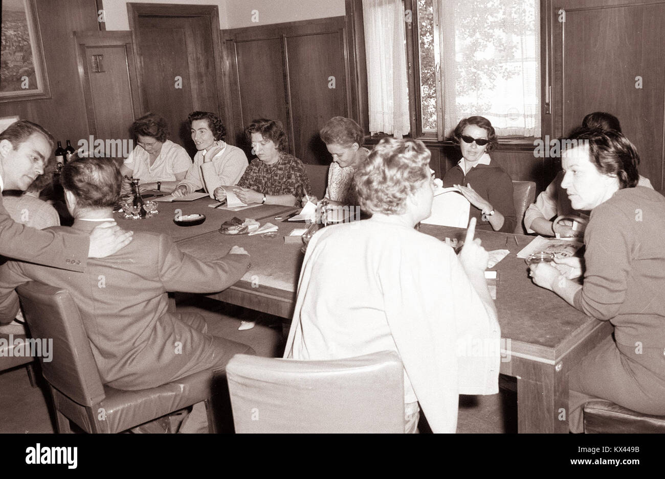 This 1961 photograph shows a group of female magazine editors attending ...