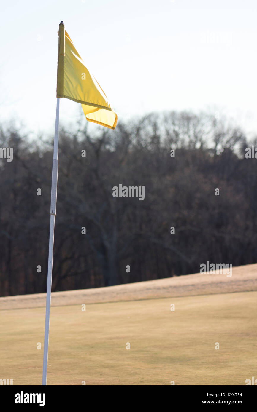A golf flag blowing in the wind Stock Photo - Alamy