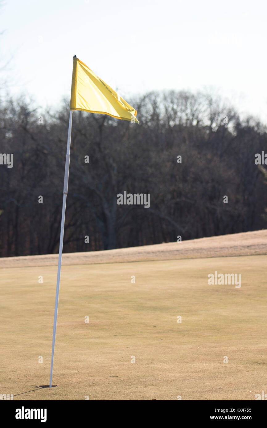 A golf flag blowing in the wind Stock Photo - Alamy