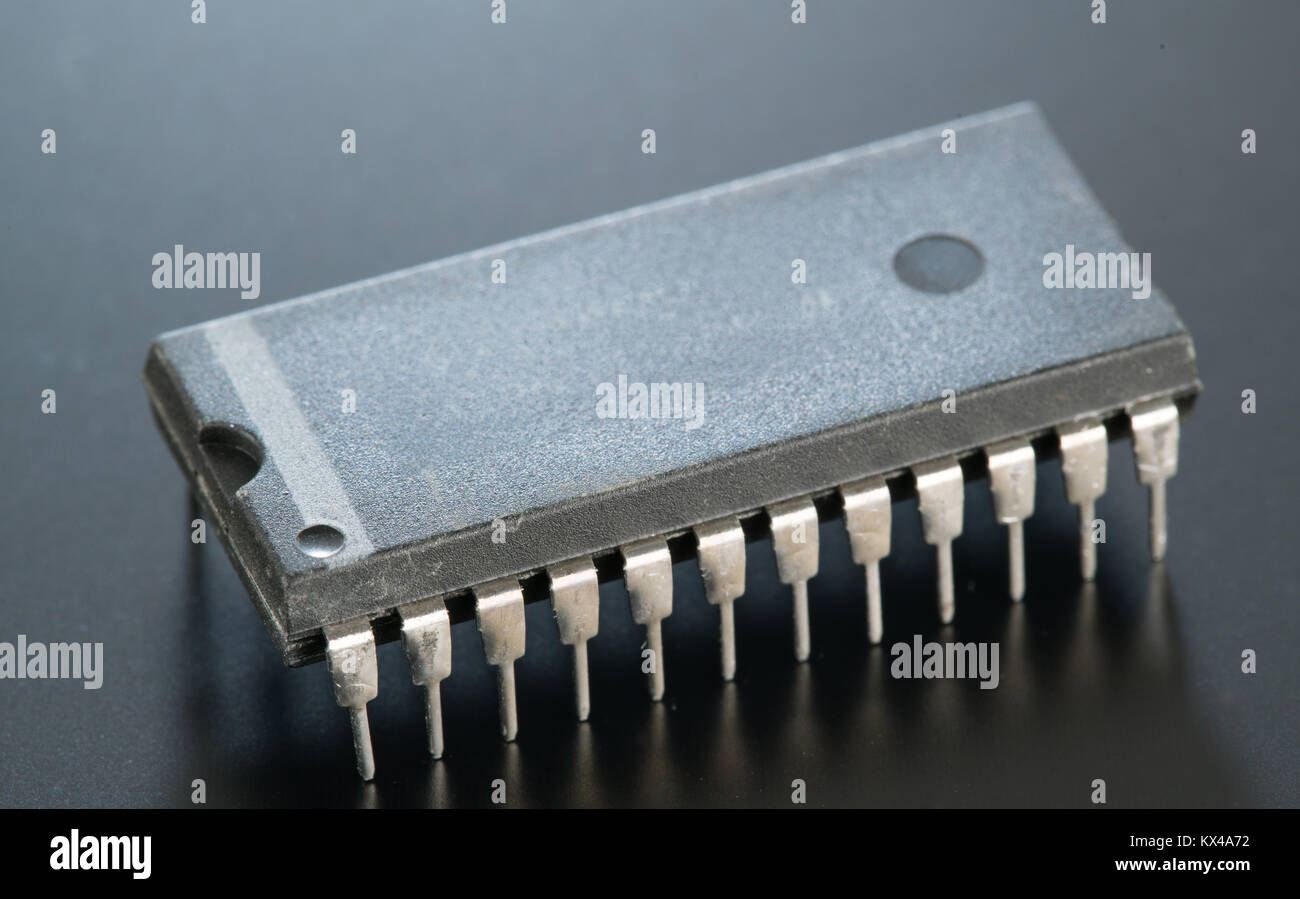 Electronic chip isolated on dark blue Stock Photo - Alamy
