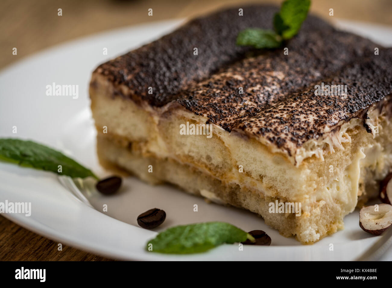 Traditional italian dessert tiramisu on wood table Stock Photo - Alamy