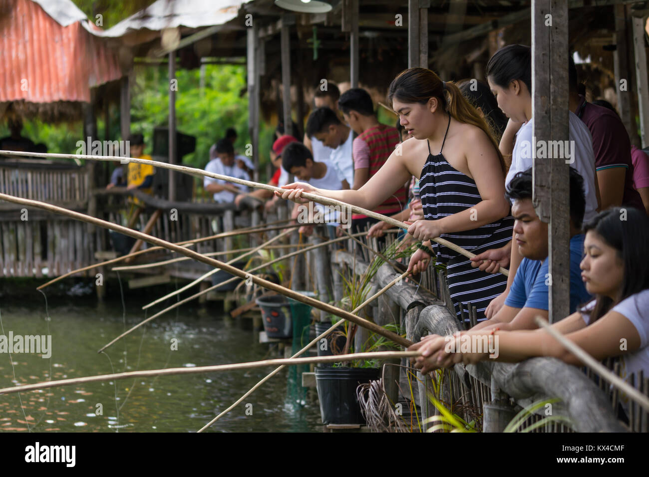 Filipino families enjoying weekend bonding by catching their own fish ...