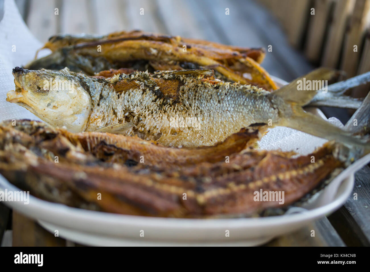 Fried whole fish hi-res stock photography and images - Alamy