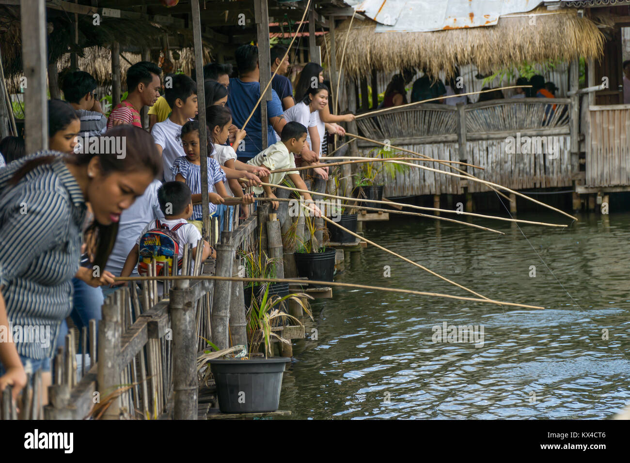 Filipino families enjoying weekend bonding by catching their own fish ...
