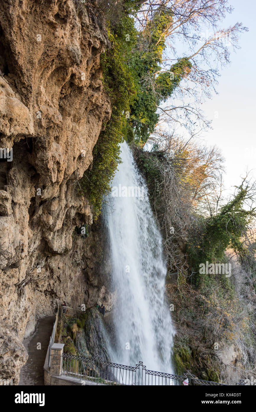 People enjoying the force of the 70 meters tall waterfall in Edessa ...