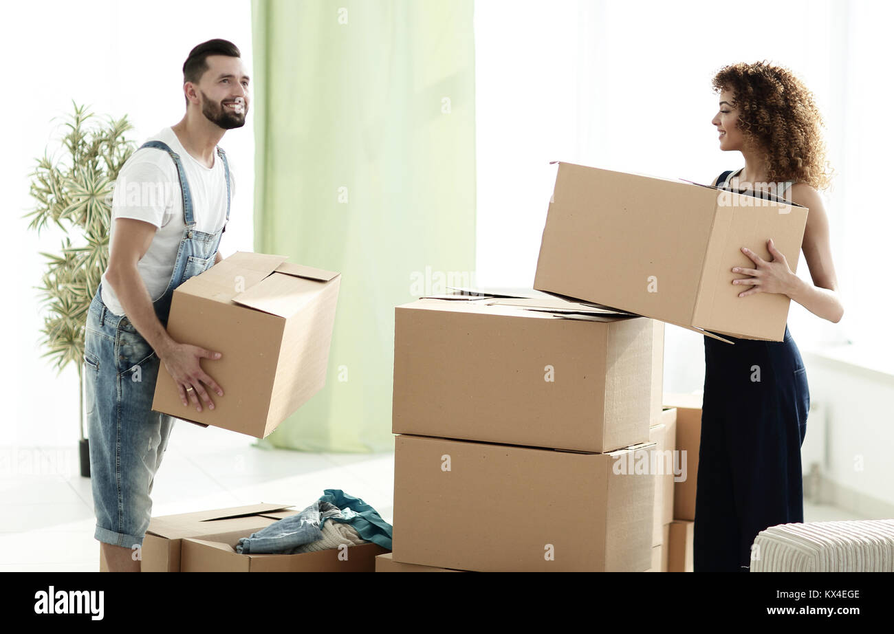 Young family unpacking boxes in a new house Stock Photo - Alamy