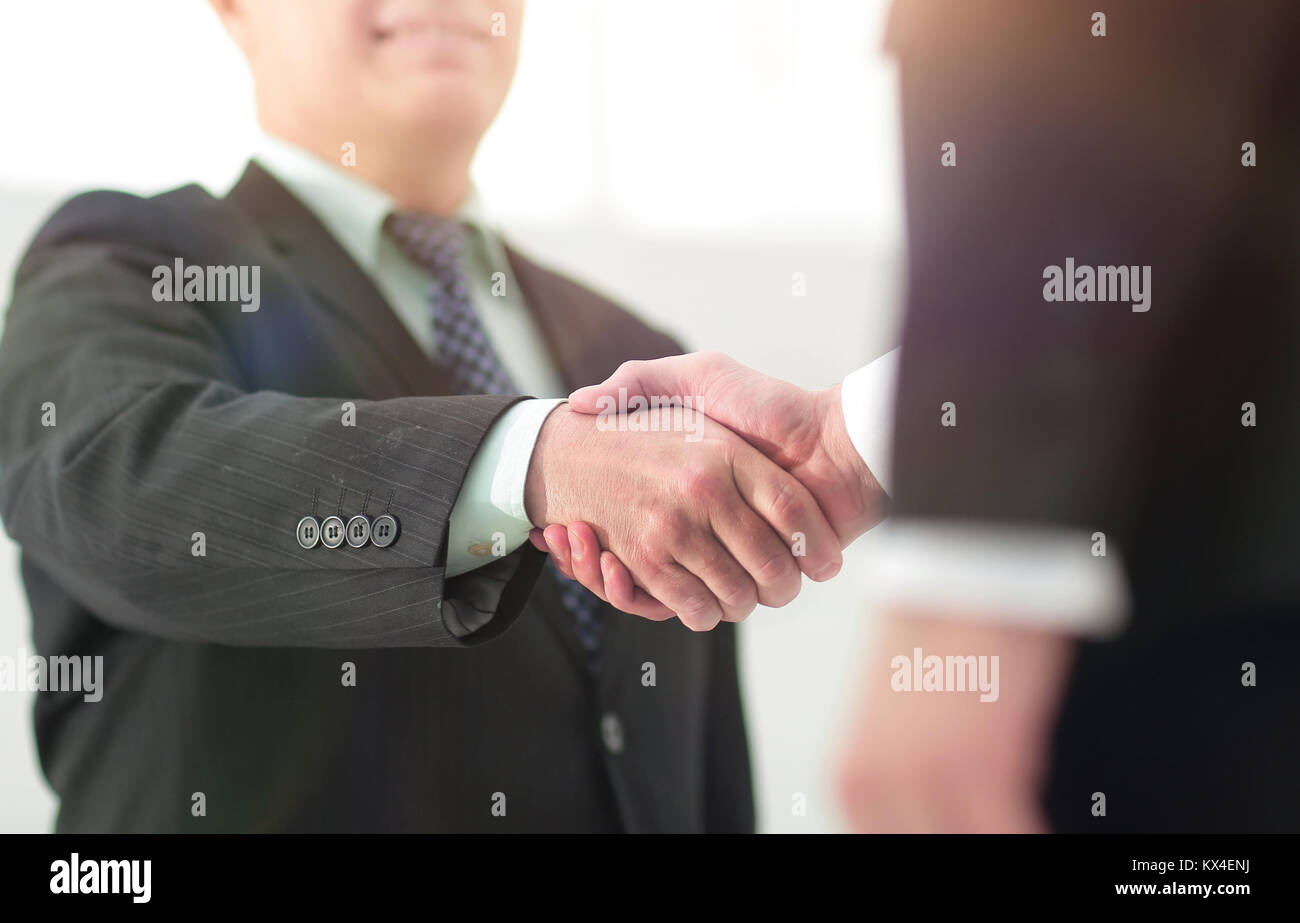 Closeup of handshake as a sign of successful cooperation and int Stock ...
