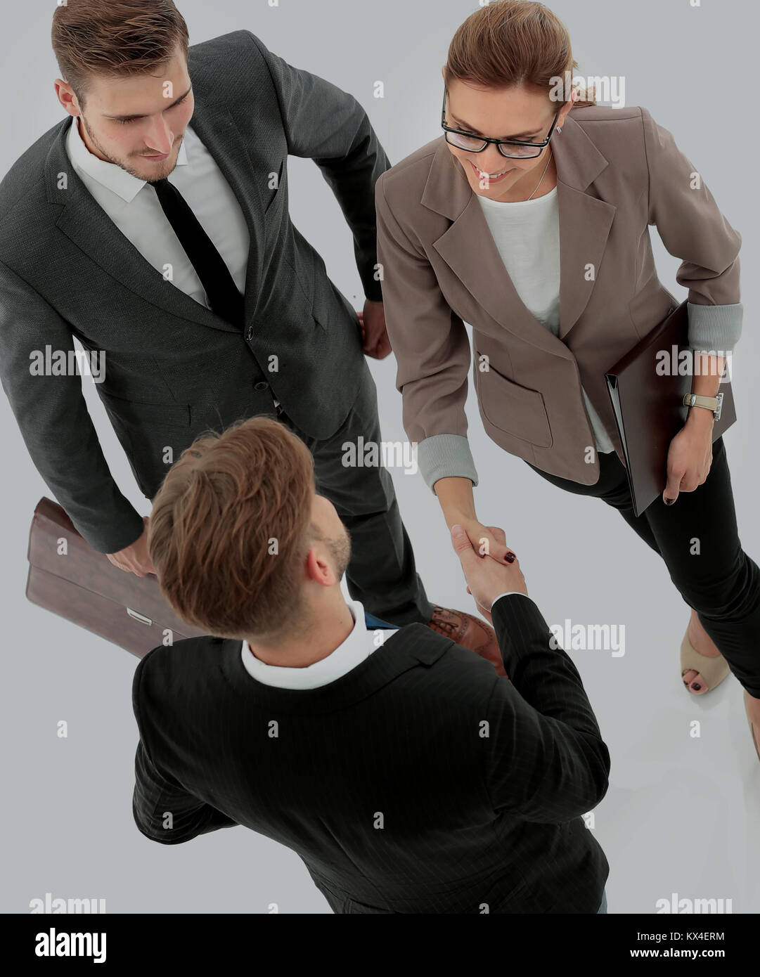 Happy business people making handshake isolated on white Stock Photo ...