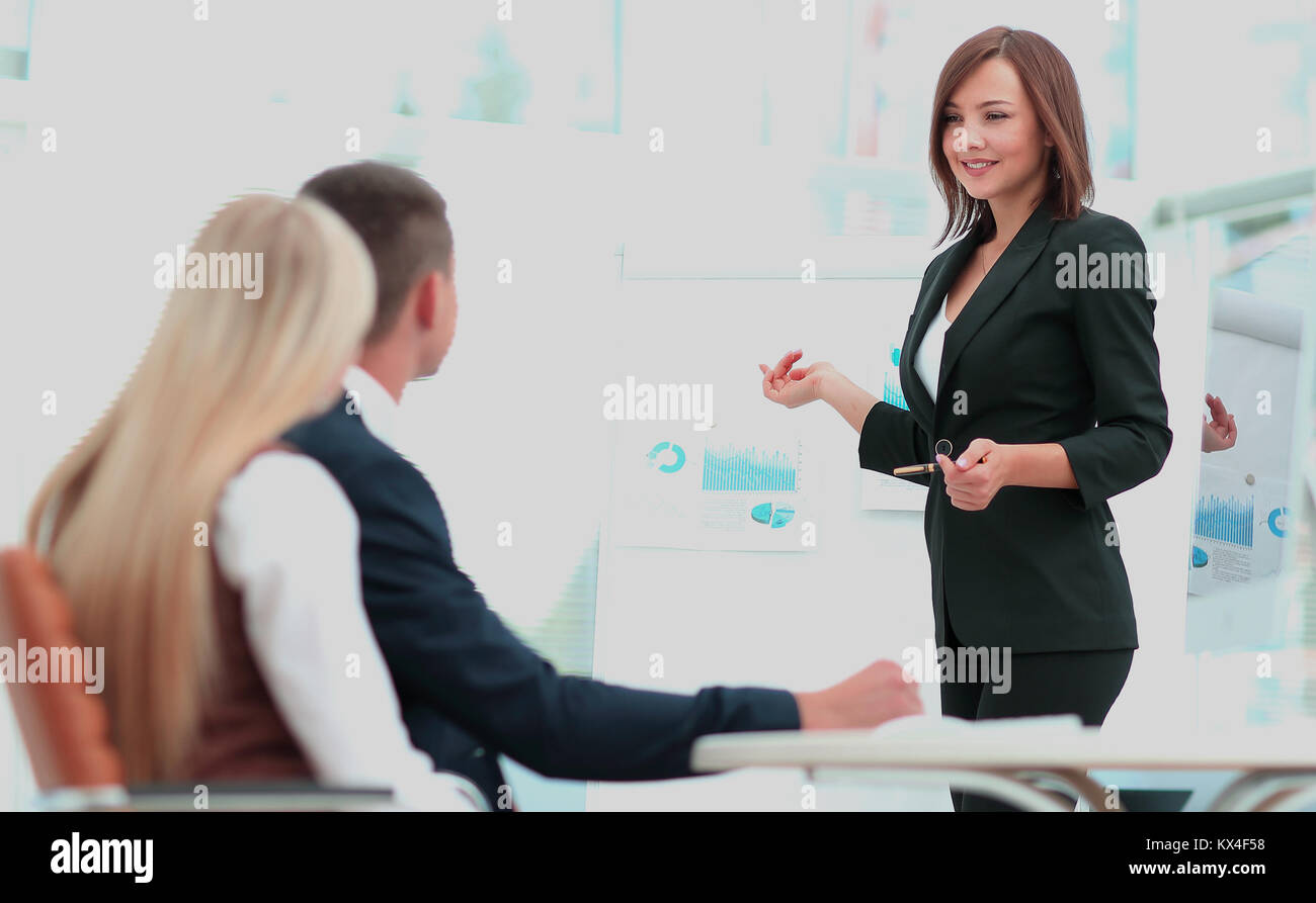 Successful businesswoman in suit at the office leading a group Stock ...