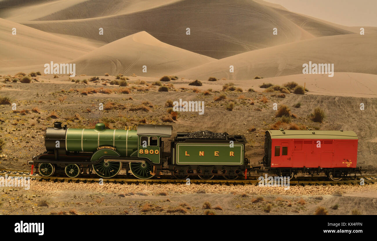 A Model of a 4-4-0 steam locomotive placed on a scenic background Stock ...