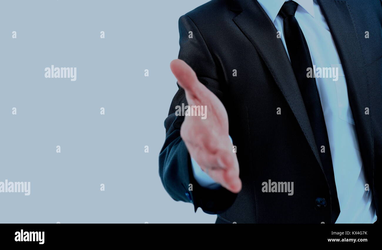 Business man saying welcome and giving hand Stock Photo - Alamy