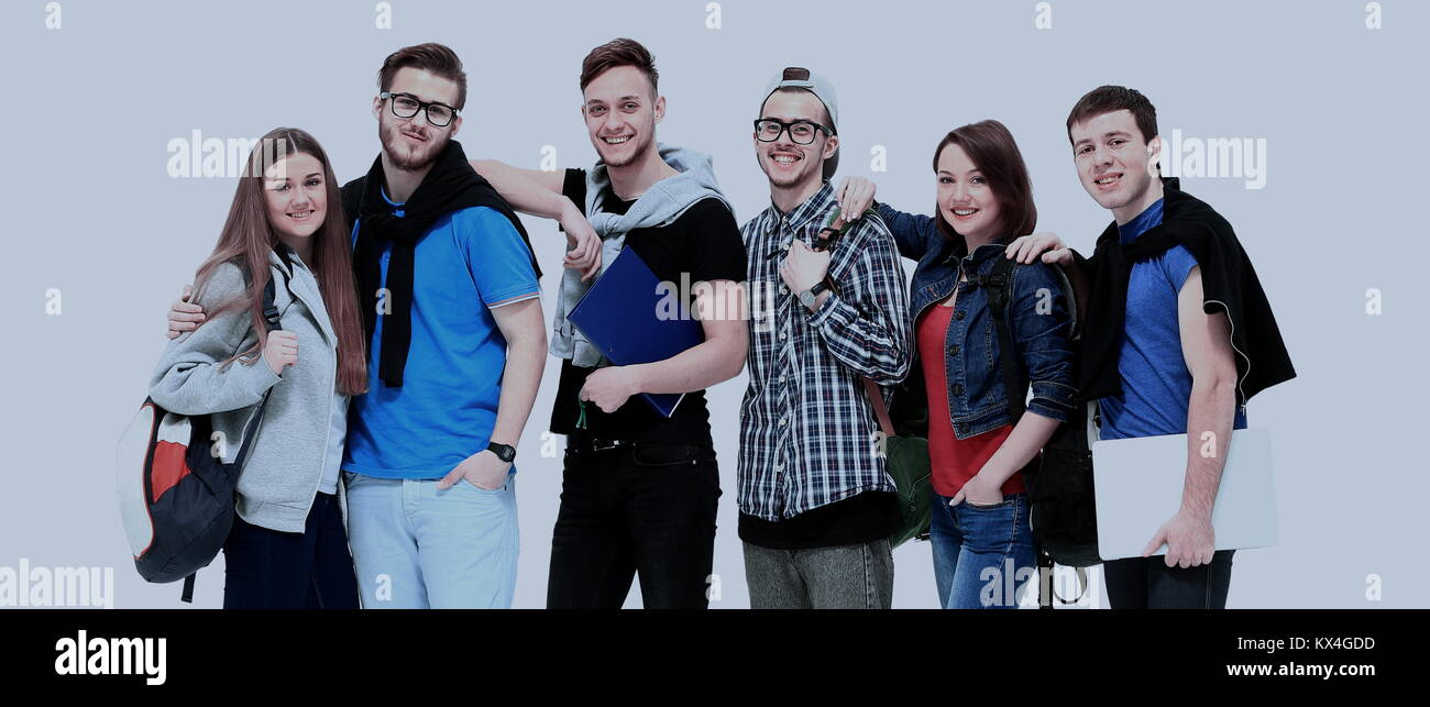 group of smiling friends staying together and looking at camera ...