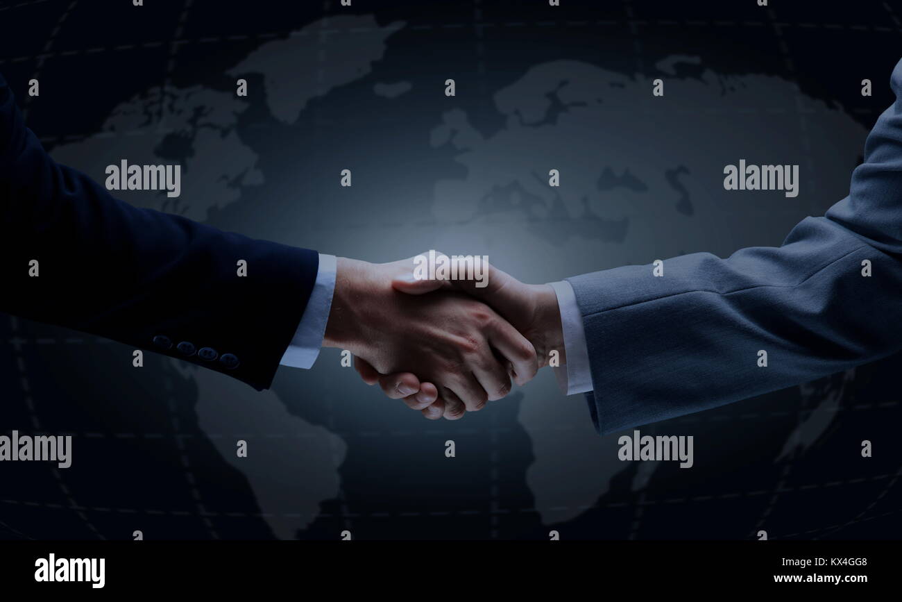 Handshake with map of the world in background Stock Photo - Alamy