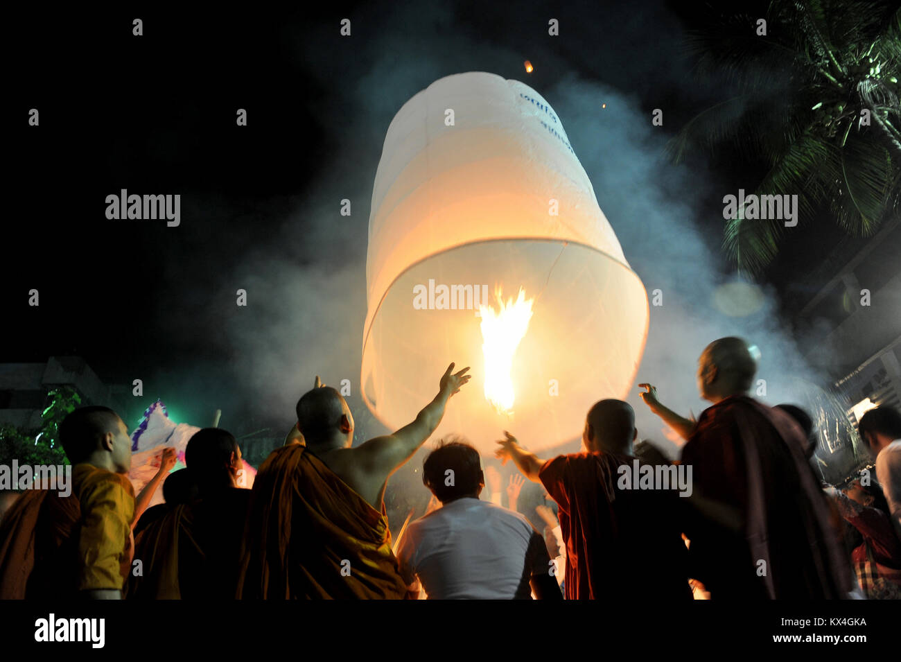 DHAKA, BANGLADESH-OCTOBER 27, 2015: Buddha people flying paper lantern ...