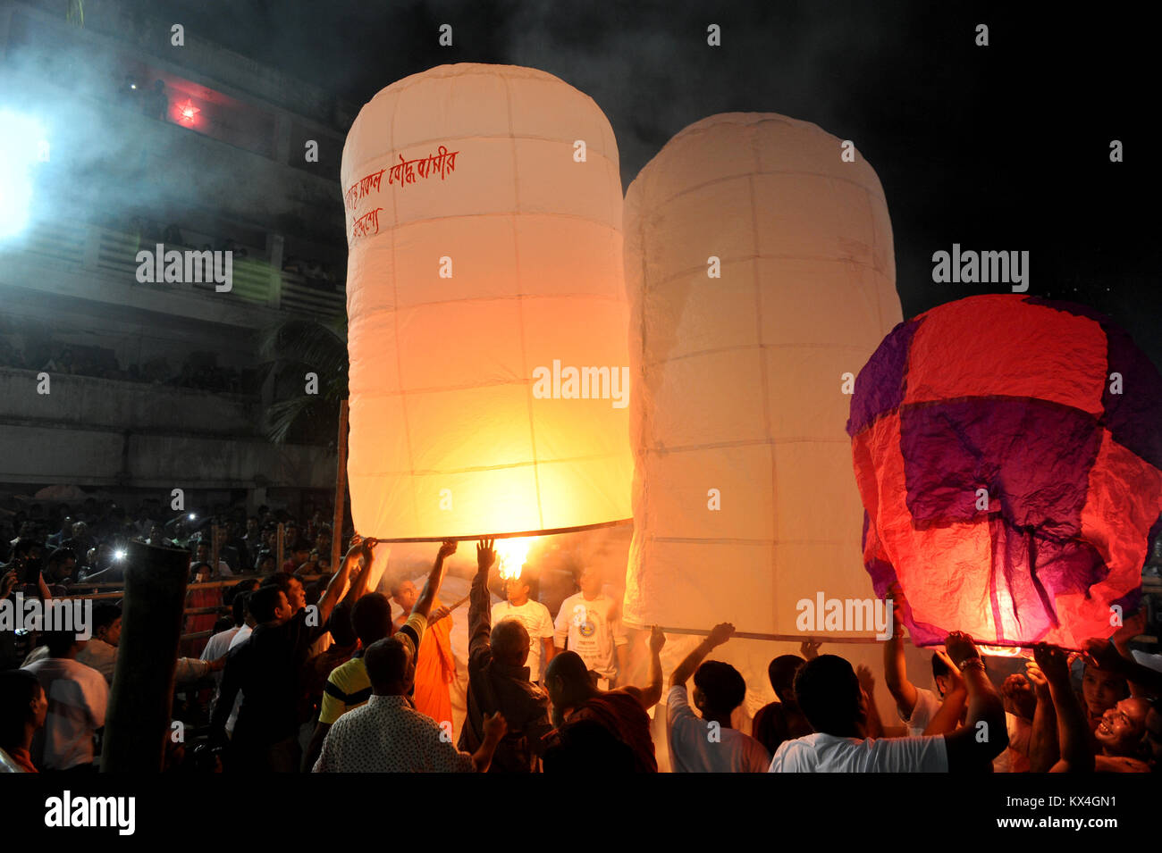 DHAKA, BANGLADESH-OCTOBER 27, 2015: Buddha people flying paper lantern ...
