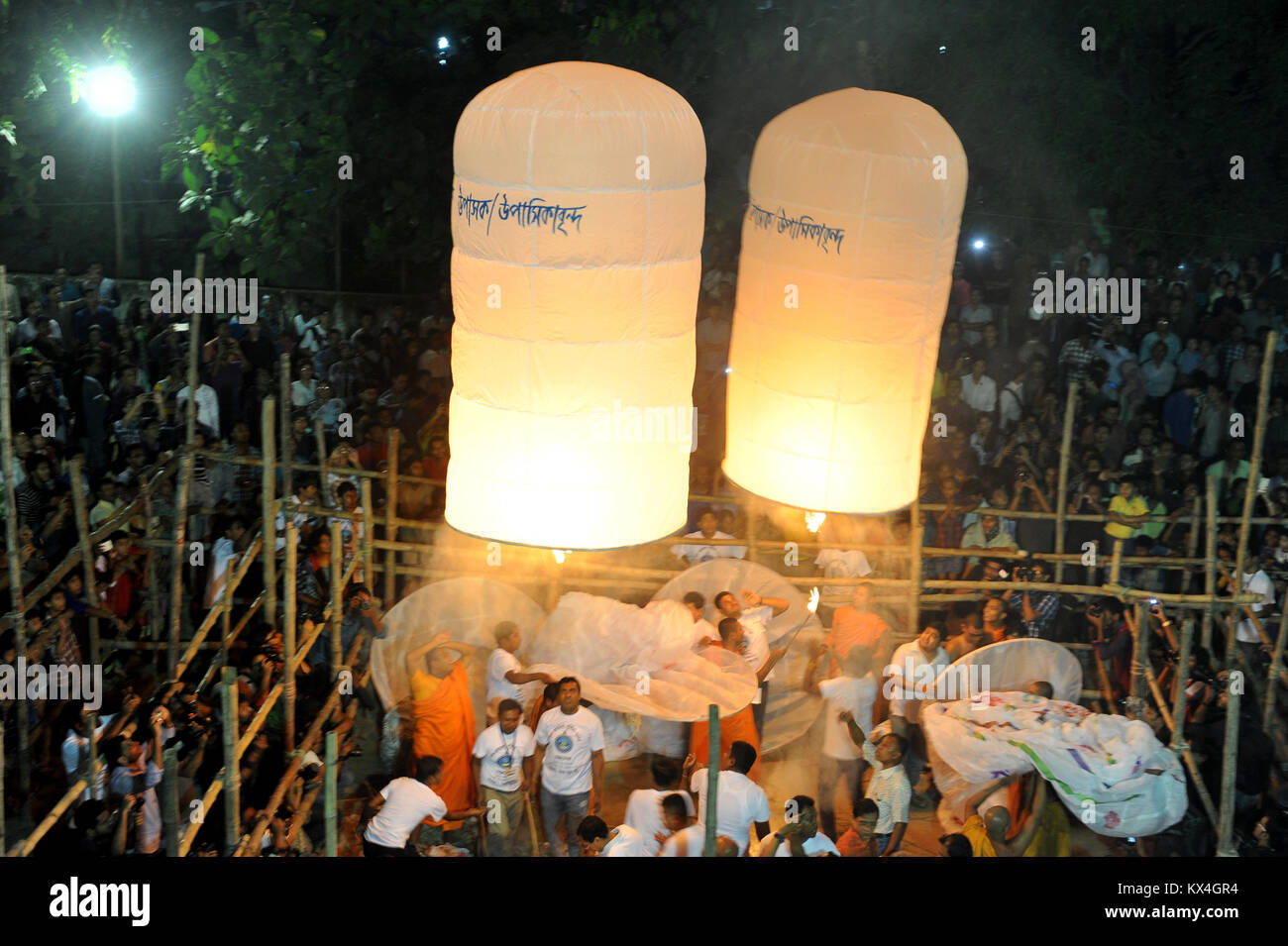DHAKA, BANGLADESH-OCTOBER 27, 2015: Buddha people flying paper lantern ...