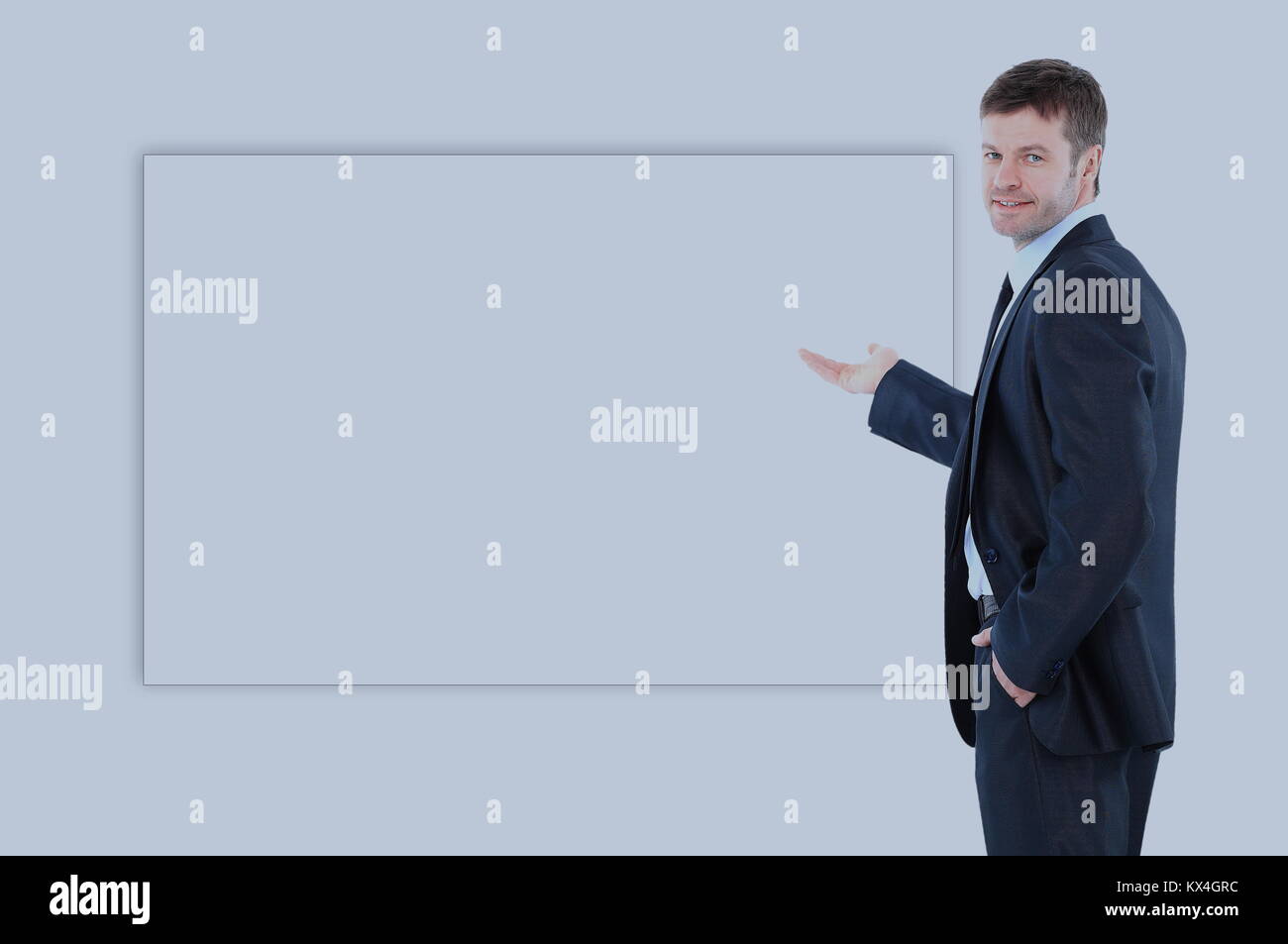 Happy business man presenting and showing with copy space for your text ...