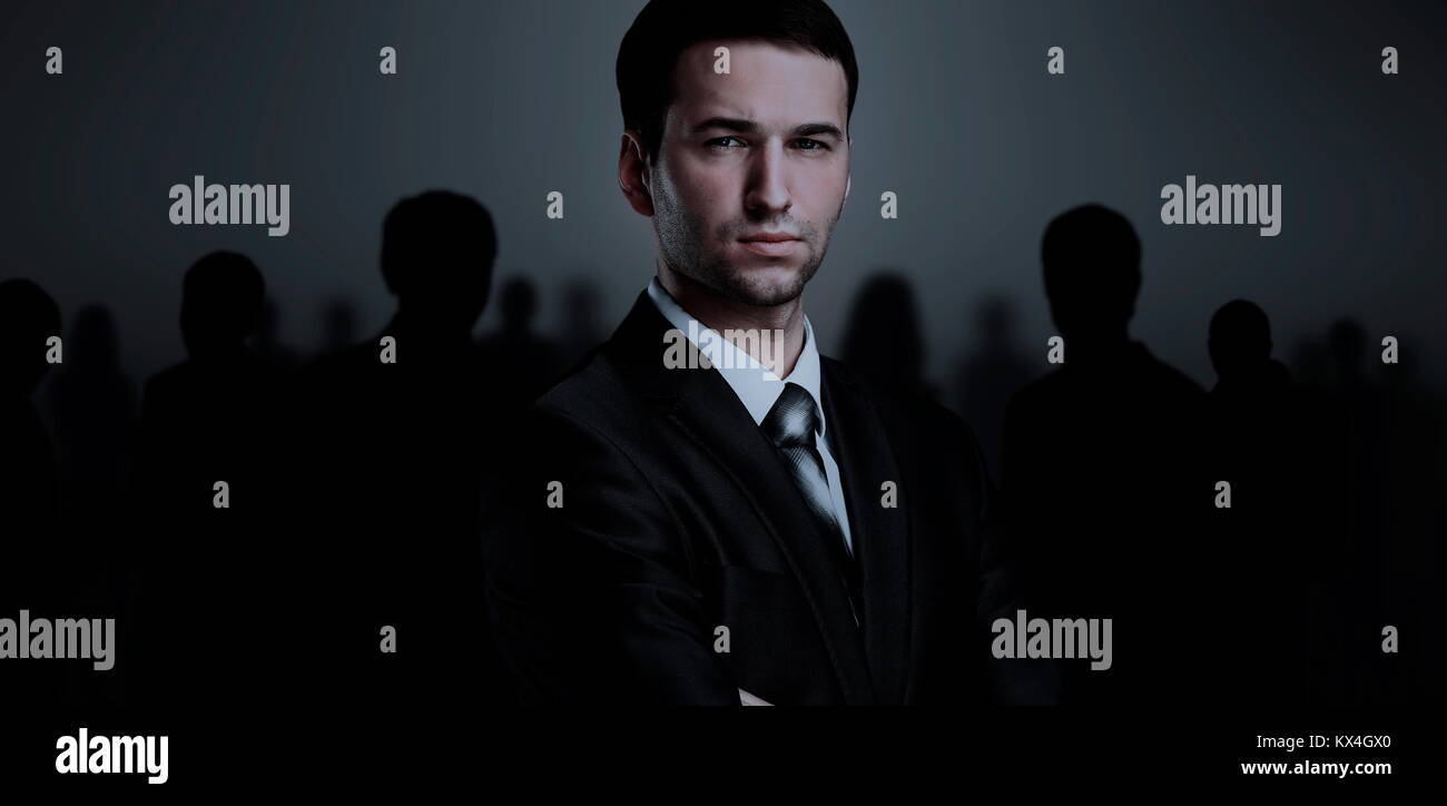 business team standing over a dark background Stock Photo - Alamy