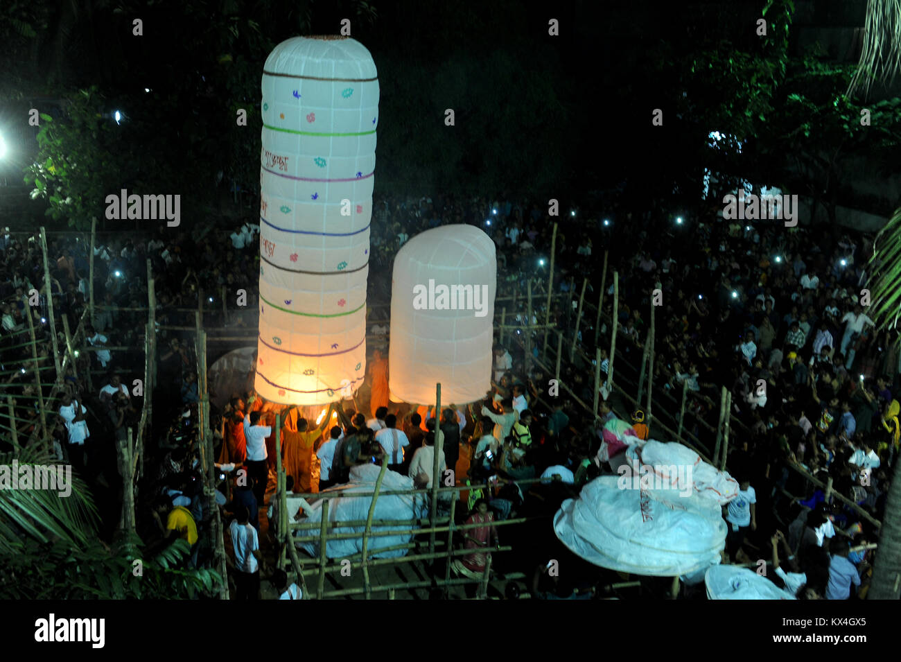 DHAKA, BANGLADESH-OCTOBER 27, 2015: Buddha people flying paper lantern ...
