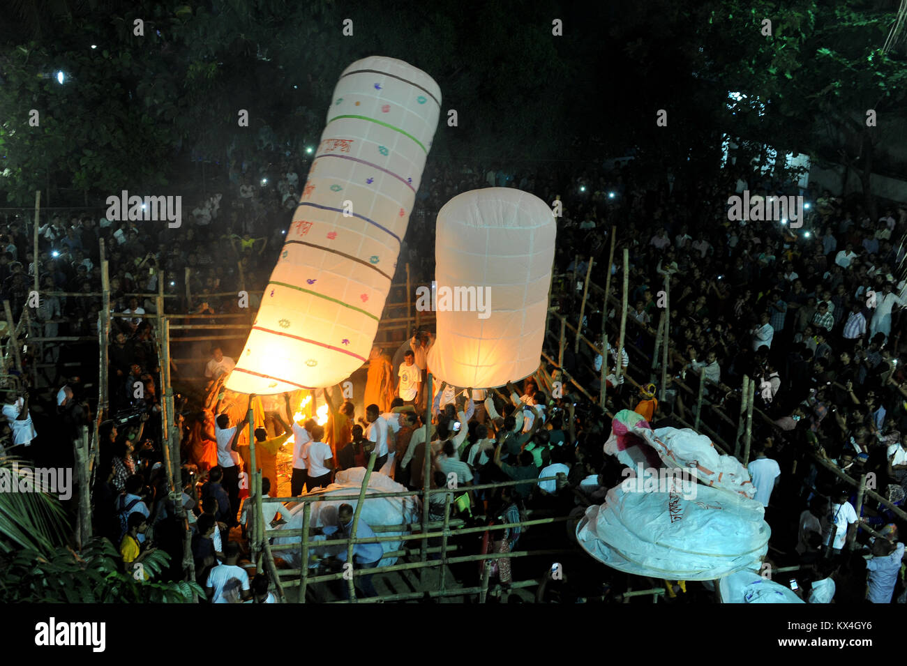 DHAKA, BANGLADESH-OCTOBER 27, 2015: Buddha people flying paper lantern ...