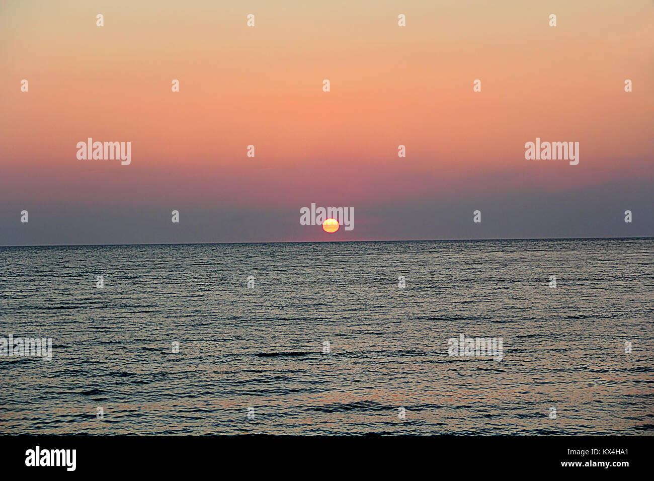 The beautiful evening sea with red sunset Stock Photo - Alamy