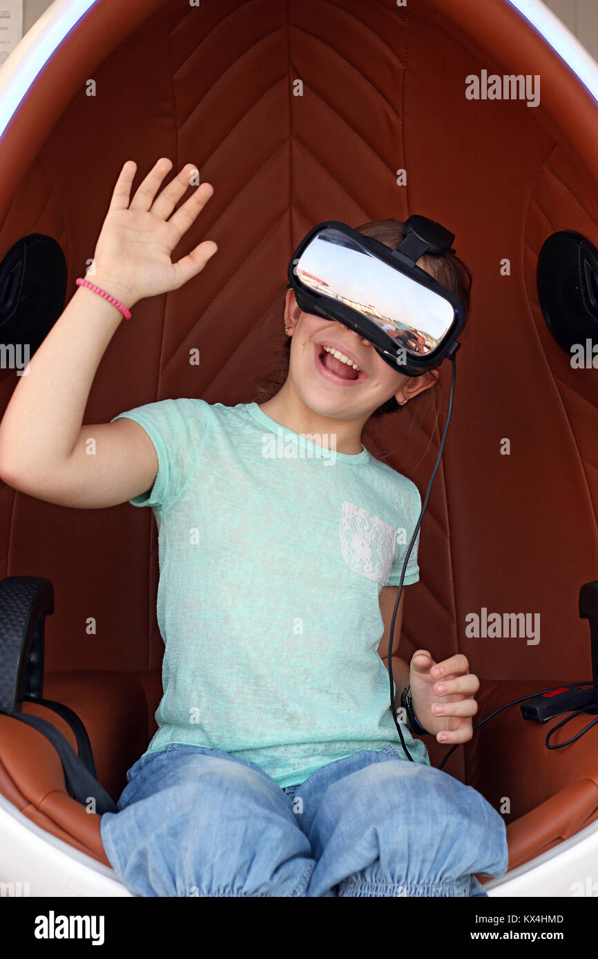 happy little girl with virtual reality headset Stock Photo - Alamy
