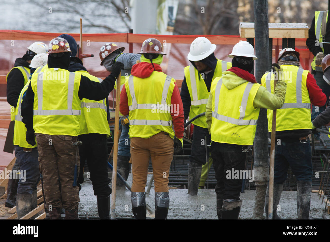 Group of builders on a construction site Stock Photo - Alamy