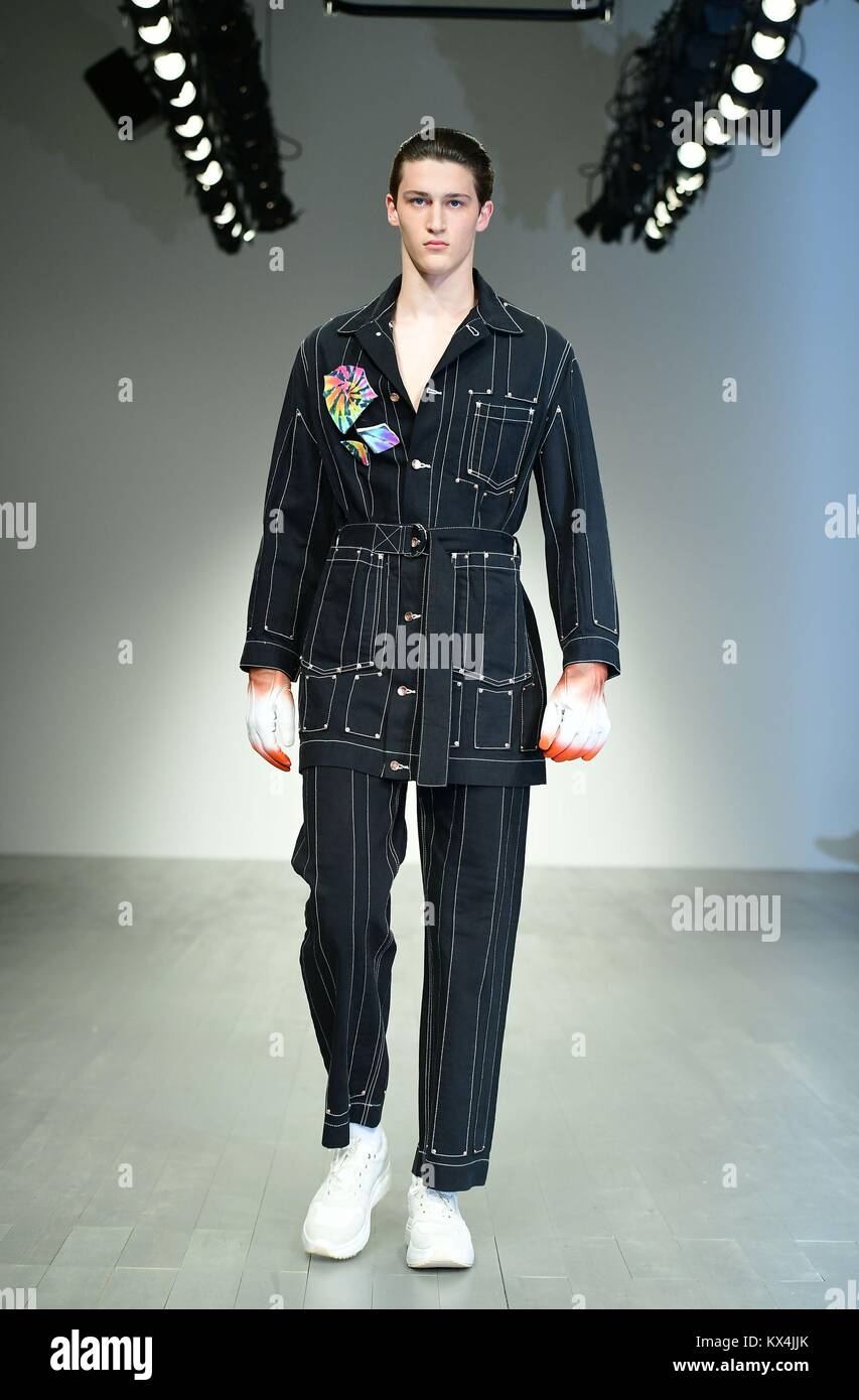 A model on the catwalk during the Alex Mullins London Fashion Week Men ...