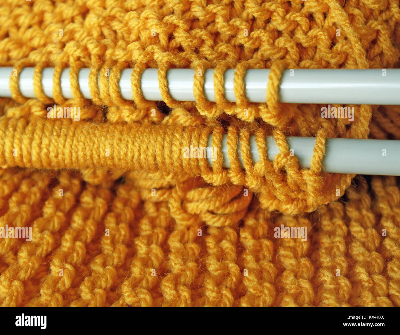Stitches of Yarn on Knitting Needles Stock Photo - Alamy