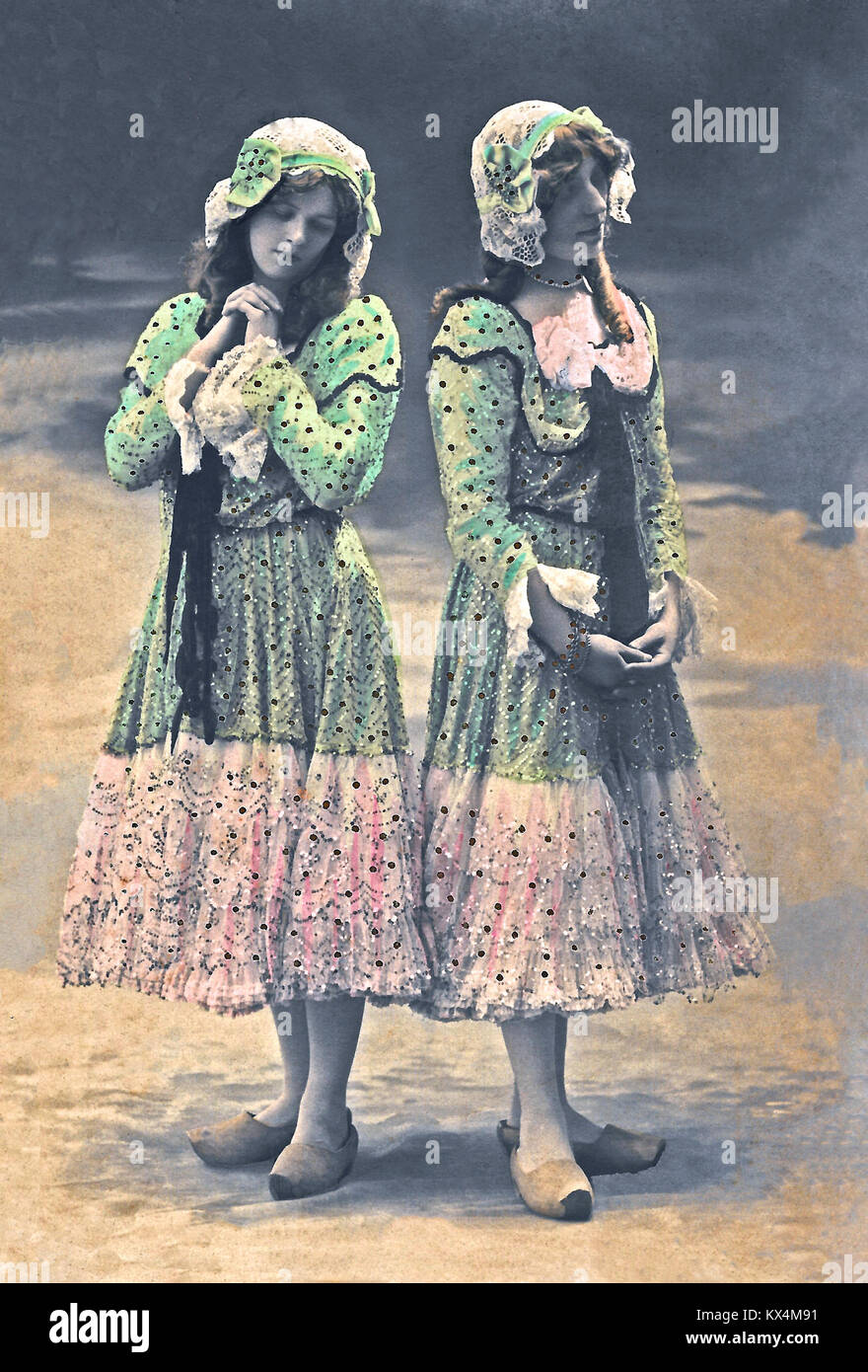 Vintage photograph of two young women in identical clothing, circa 1910 ...