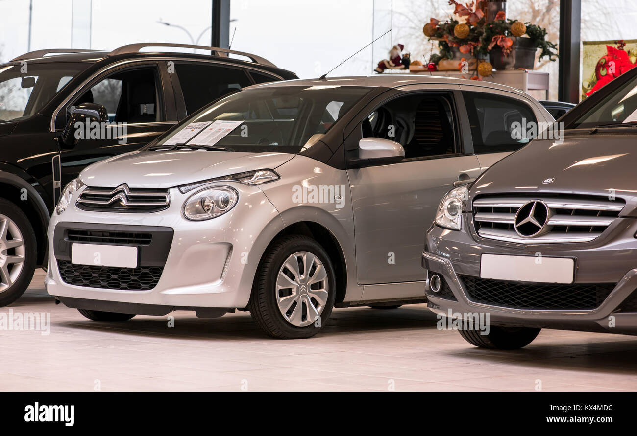 cars available for sale in a showroom at the car dealer Stock Photo - Alamy