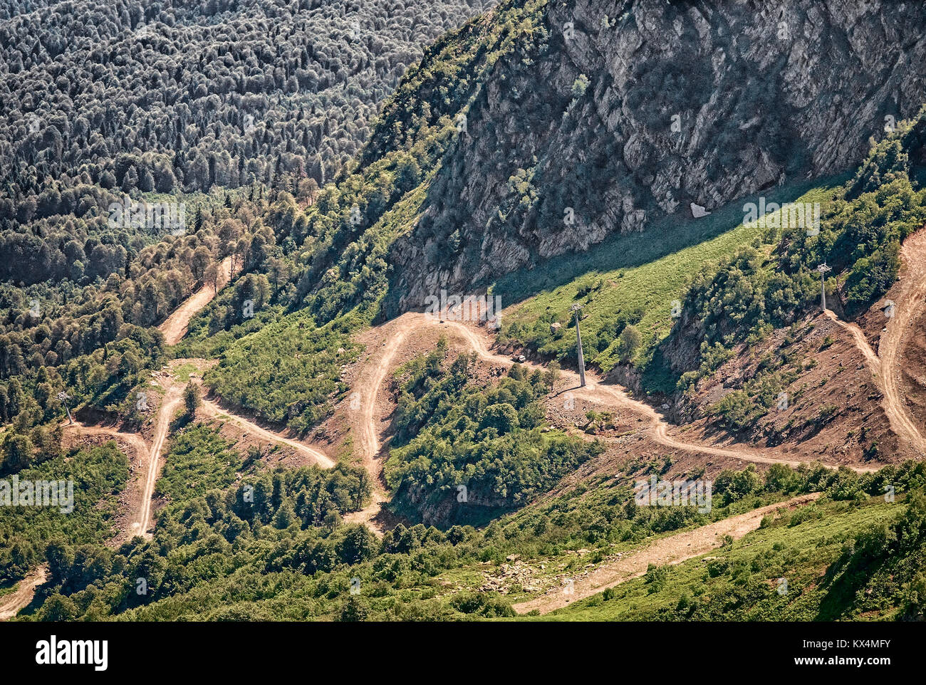 Mountain landscape: steep mountains, covered with forests, form a deep ...
