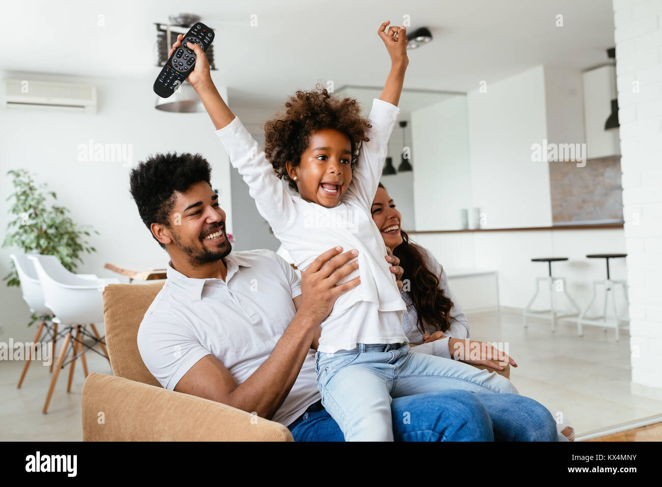 Family lifestyle portrait of a mum and dad with their kid Stock Photo ...