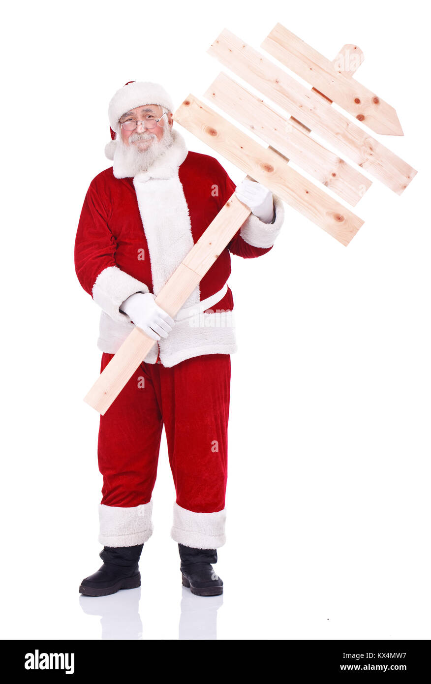 Santa Claus holding blank wooden sign as road sign, isolated on white ...