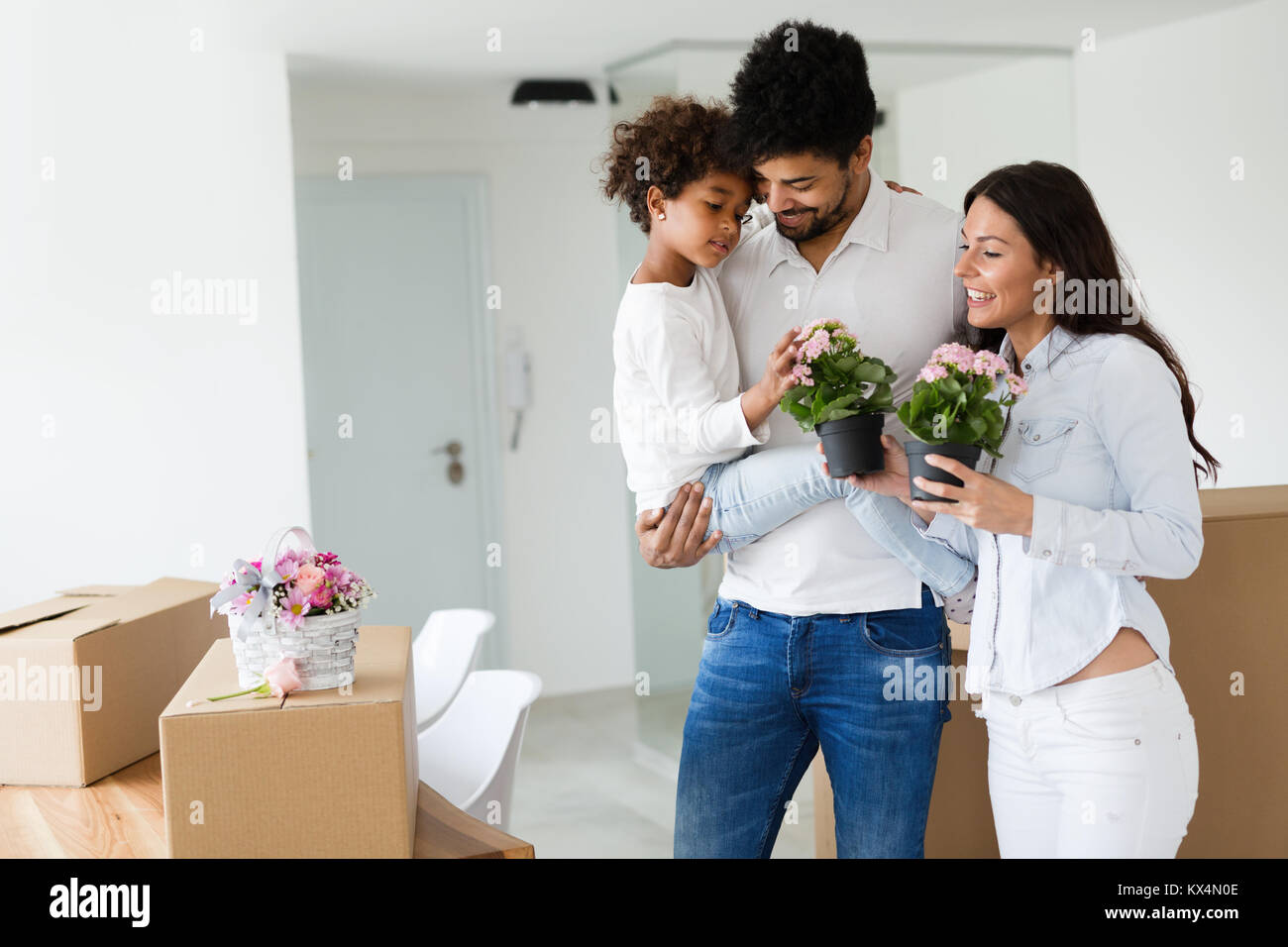 Happy family with cardboard boxes Stock Photo - Alamy