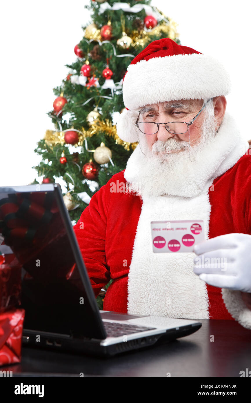 Santa Claus buying on-line using credit card, isolated on white ...