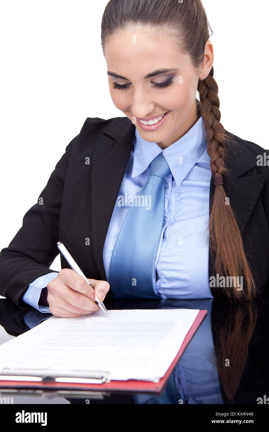 smiling young business woman signing a contract, close up, isolated on ...