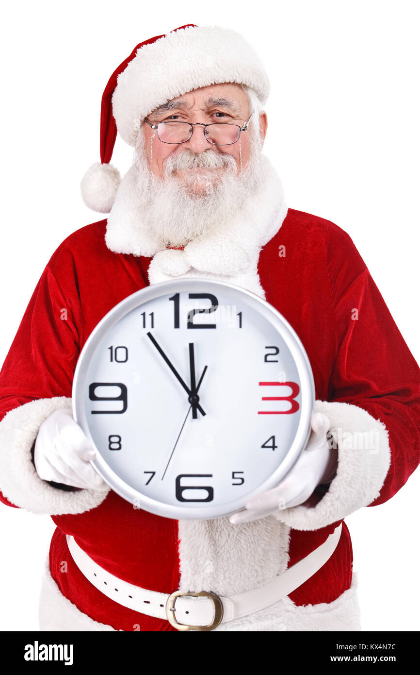 Santa Claus with real beard holding clock, clock showing five minutes ...