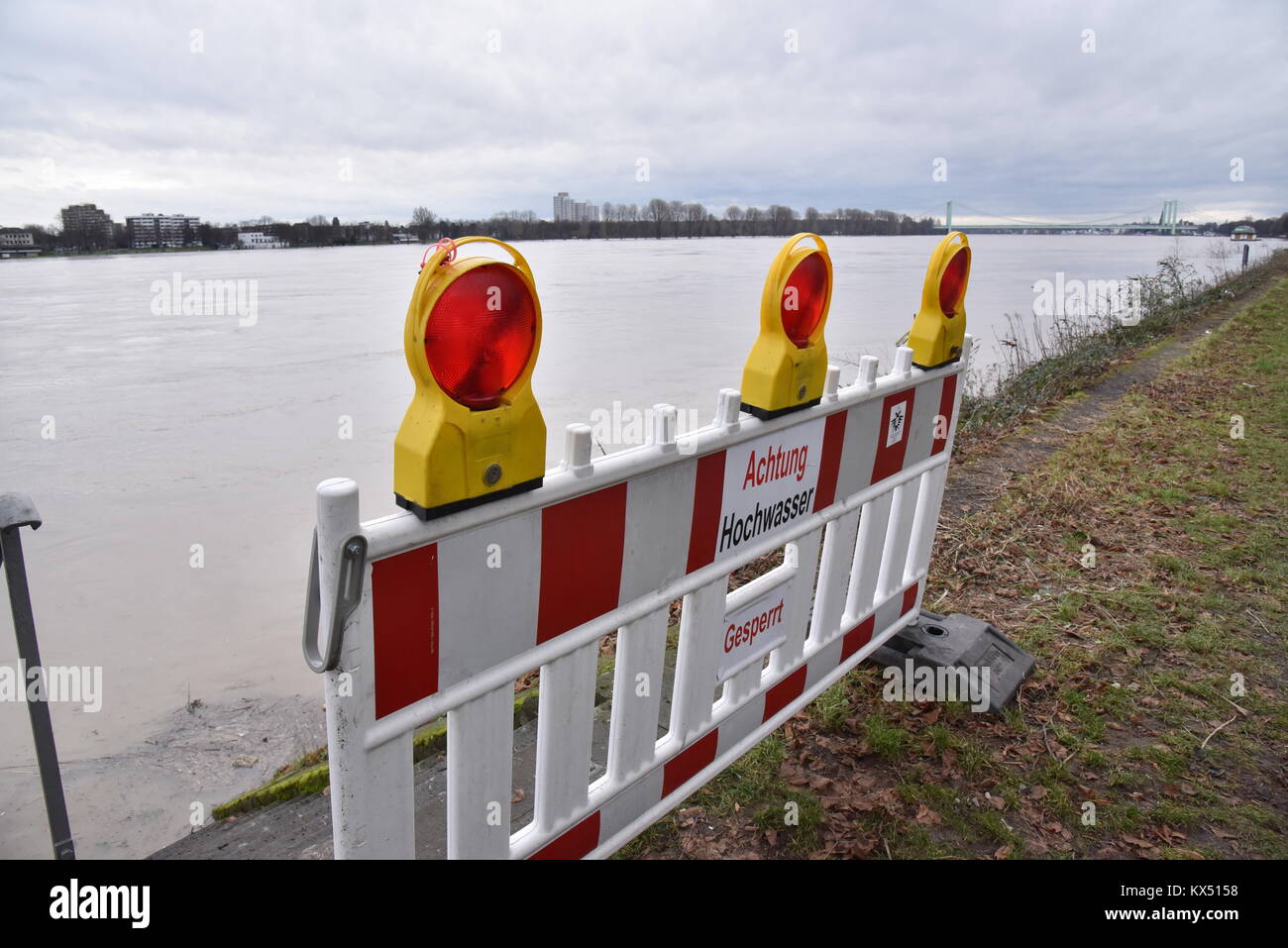 Cologne, Germany. 7th Jan, 2018. A red-and-white barrier with warning ...
