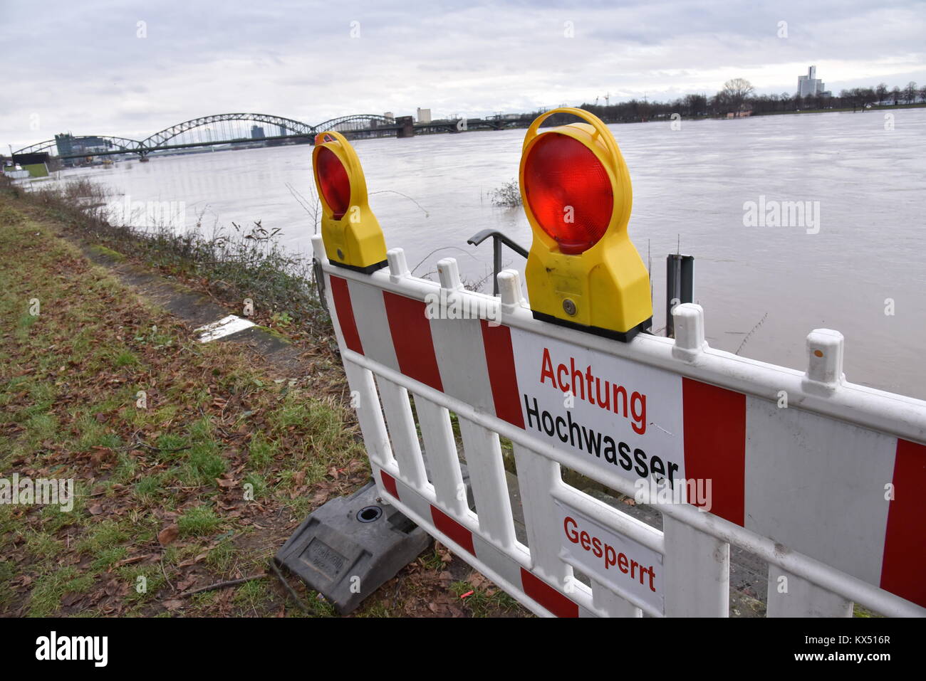 Cologne, Germany. 7th Jan, 2018. A red-and-white barrier with warning ...