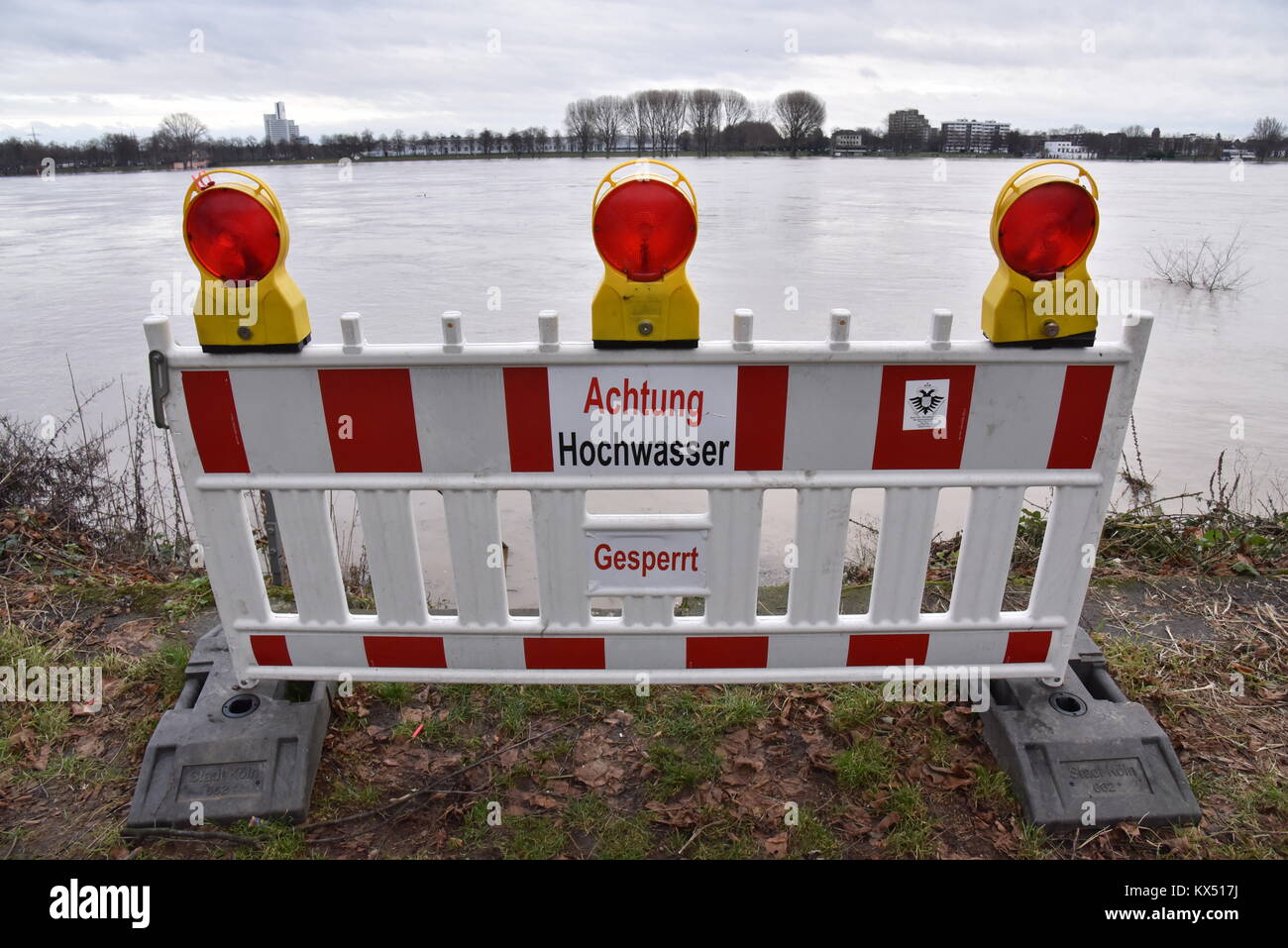 Cologne, Germany. 7th Jan, 2018. A red-and-white barrier with warning ...