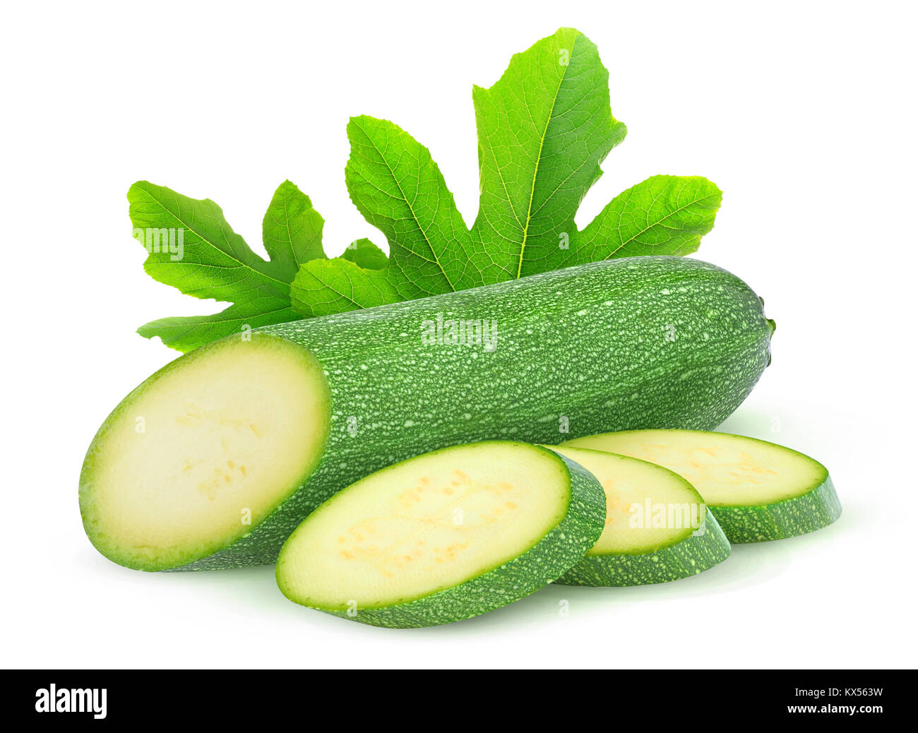 Isolated zucchini. One cut courgette with leaves isolated on white ...