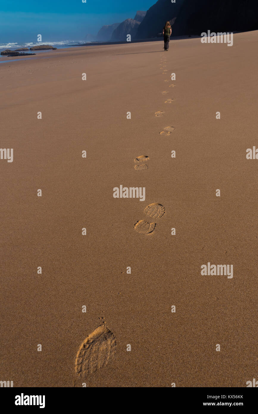 Traces in the sand walking on the beach Stock Photo - Alamy